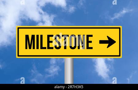 Milestone road sign on sky background Stock Photo - Alamy