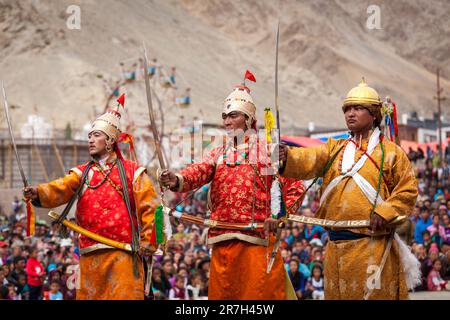 Dancers in traditional Ladakhi Tibetan costumes perform warlike Stock ...
