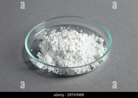 Petri dish with calcium carbonate powder on white background Stock ...