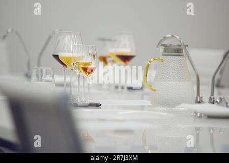 Blind tasting, various full glasses with different alcoholic beverages ...