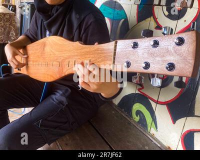 Sapeh, or Sape, a traditional Dayak string instrument of Borneo origin ...