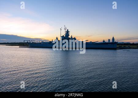 Aerial view of the USS Alabama battleship and the Mobile skyline at ...