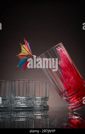 Sloshing, spilling drink with crushed ice Stock Photo - Alamy