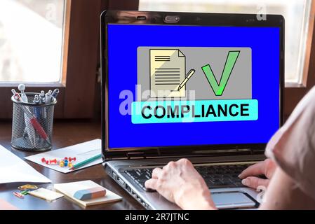 Laptop screen displaying a compliance concept Stock Photo - Alamy