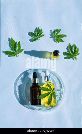 Cbd Oil Bottles, Blue water background with drops, waves and leaves of ...