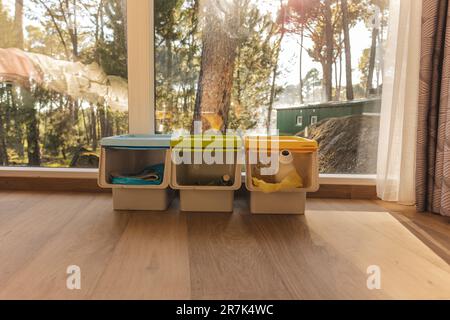 Three waste bins for waste separation Stock Photo - Alamy