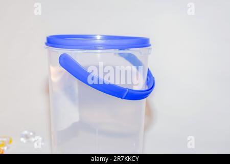 The Versatile Blue Plastic Cylinder Container with Lid is a practical ...