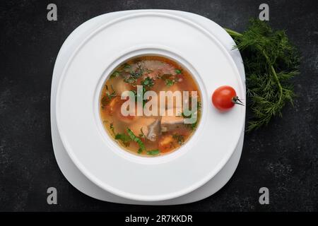 Red fish ear with tomatoes, garlic and spices Stock Photo - Alamy