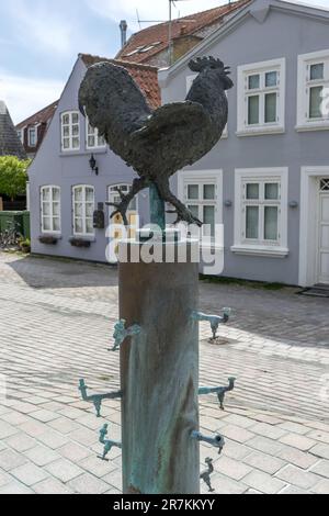 Bronze sculpture with rooster and chickens Source Stock Photo - Alamy