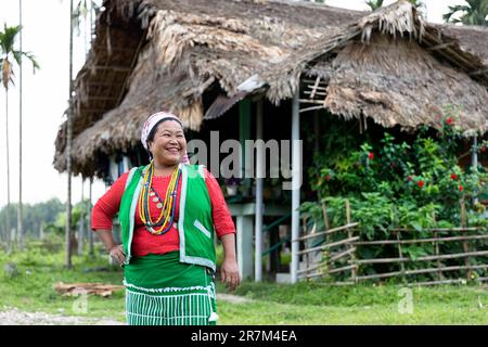Woman from galo tribe in her traditional clothes posing infront of her ...