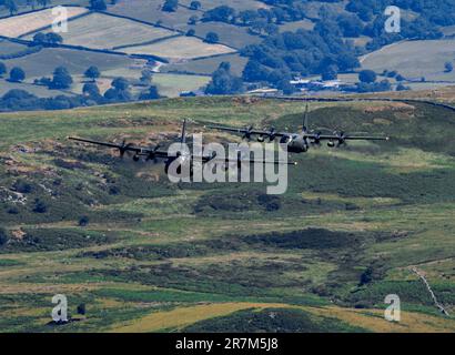 three RAF Hercules C130 pass through The Mach Loop in North Wales as ...
