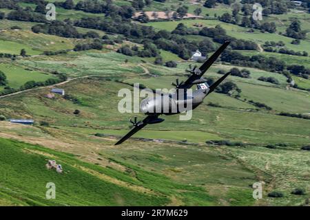three RAF Hercules C130 pass through The Mach Loop in North Wales as ...