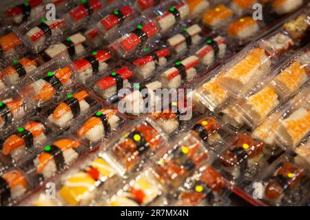 Bunch of Mini sushi on display to buy Stock Photo - Alamy