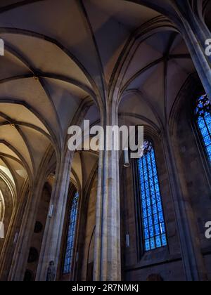 A grand architectural space featuring intricate arches, columns, and a ...