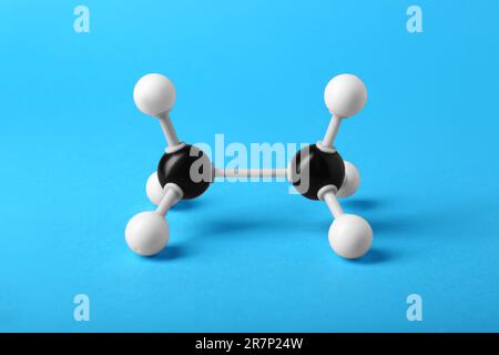 Molecule of alcohol on light blue background, space for text. Chemical ...