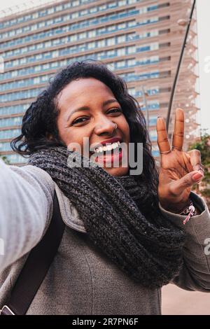 Photo of charming pretty african lady dressed white sweater smiling ...