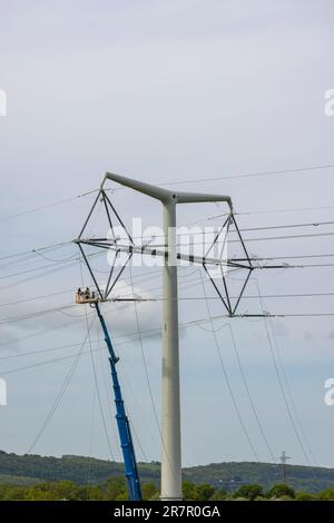 Pulling the power cables through snatch blocks Stock Photo - Alamy