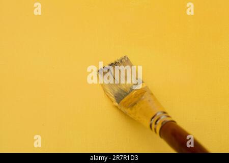 Canvas with a yellow ground color, uneven rough weave Stock Photo - Alamy