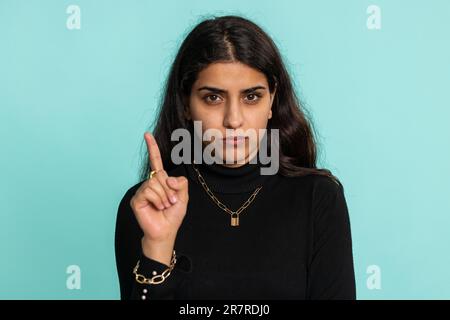 Attractive woman shakes finger and saying No, be careful, scolding and ...