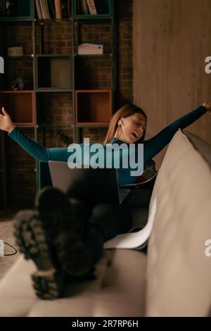 Excited girl waving her hands up and feeling relieved after she ...