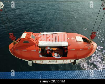 lounging life boat from a ship with crew,life boat lounging,,safety ...