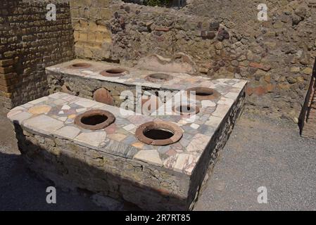 Remains of Dolium storage jars in Roman shop counters in the town of ...