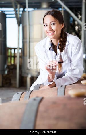 Woman sommelier is tasting wine at wine factory Stock Photo - Alamy