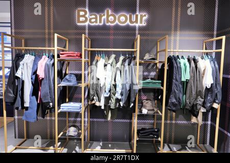 BARBOUR CLOTHING ON DISPLAY INSIDE THE FASHION STORE Stock Photo - Alamy