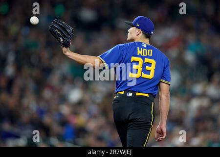 Seattle Mariners starting pitcher Bryan Woo walks the mound against a ...