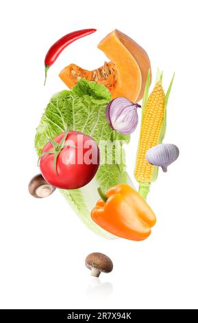 Many different fresh vegetables falling on white background Stock Photo ...