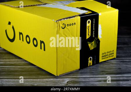 Cairo, Egypt, June 12 2023: Noon online shopping delivery yellow box ...