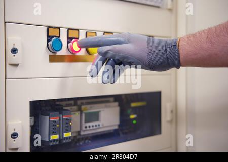 The industrial display shows the voltage of the electrical circuit. The ...