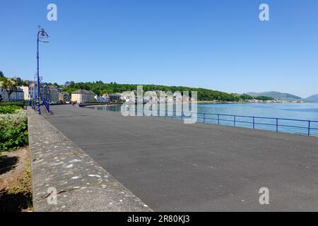 Seaside resort town of Rothesay with people swimming in the bay on a ...