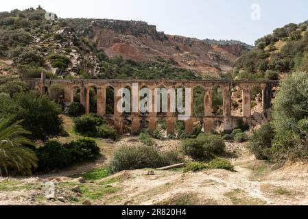 Ancient Haroune aqueduct near the archeological Roman city of Volubilis ...