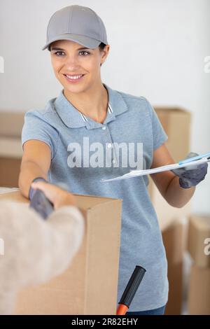 Young hispanic woman wearing delivery uniform and cap with a happy and ...