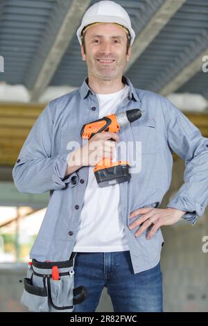 Contractor employee with hand power drill on white background Stock ...