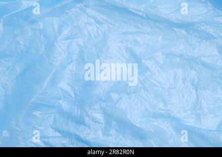 Crumpled light blue plastic bag as background, top view Stock Photo - Alamy