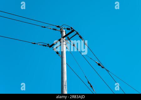 Electric utility power pole installation. Electrical grid ...