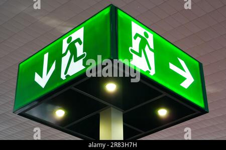 Emergency exit sign, cube light on ceiling, concept Stock Photo - Alamy