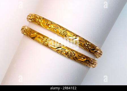 Gold bangles, women wear on the arm or wrist called bangle on white ...
