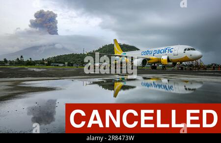 Erupting Mayon volcano, Cebu Pacific plane reflection in Legazpi ...