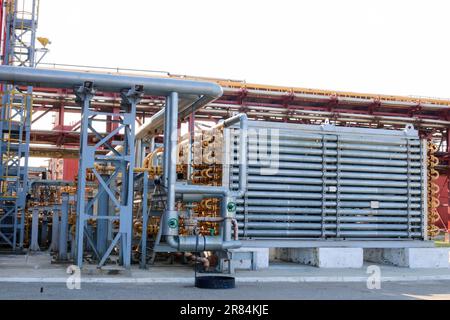 Chemical plant at dusk. View of the reactor towers of a chemical ...