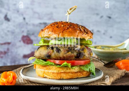 Plantain and black bean burger in brioche bun Stock Photo - Alamy