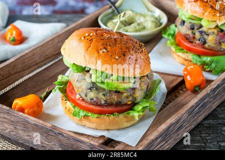 Plantain and black bean burger in brioche bun Stock Photo - Alamy