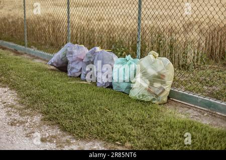 A striking image of abandoned trash bags, irresponsibly left by the ...