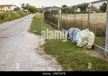 A striking image of abandoned trash bags, irresponsibly left by the ...