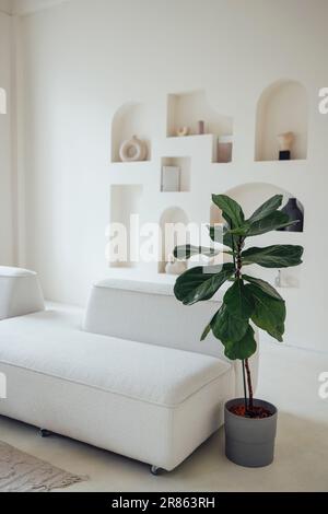 Interior of stylish living room with vases and lilac flowers Stock ...