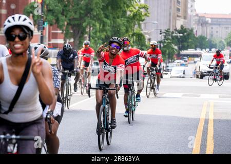 A group of bicyclists head out on a bike ride from a Juneteenth health ...