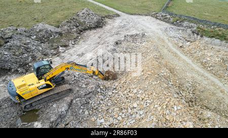360 Excavator in a quarry for stone to be used in dry stone walling on ...
