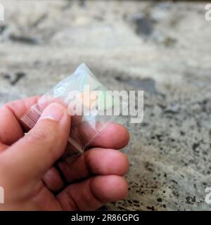 Tesla ecstasy pills in orange, green, and blue color shaped like a ...